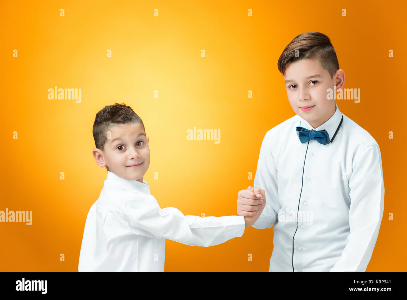 Happy children playfully fighting Stock Photo - Alamy