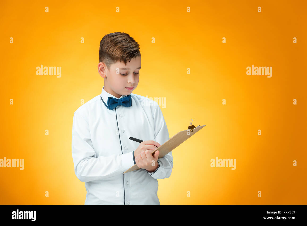 The boy with pen and tablet for notes Stock Photo - Alamy