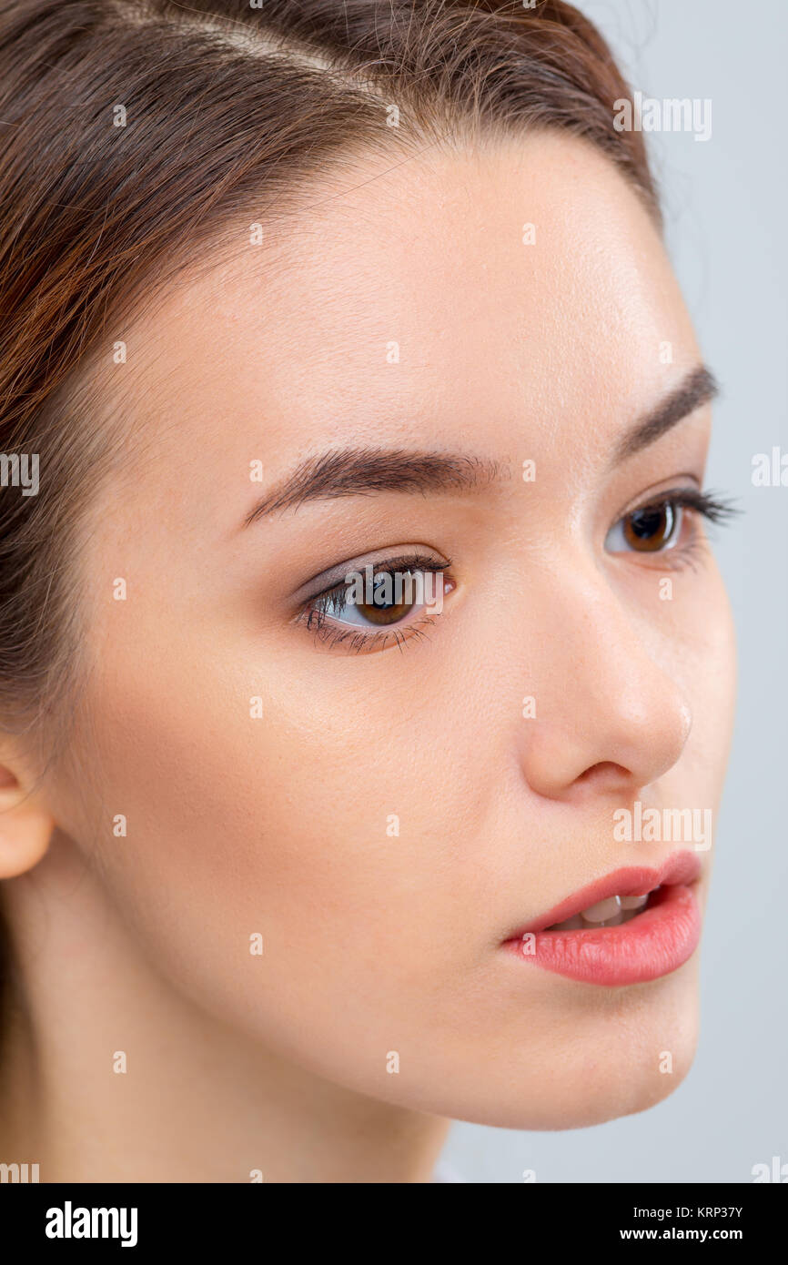 The face of woman on gray background Stock Photo - Alamy