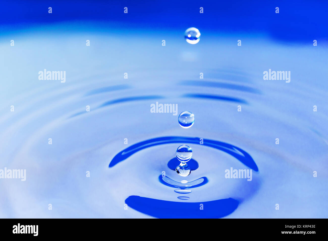 Three water drops falling abstract Stock Photo - Alamy