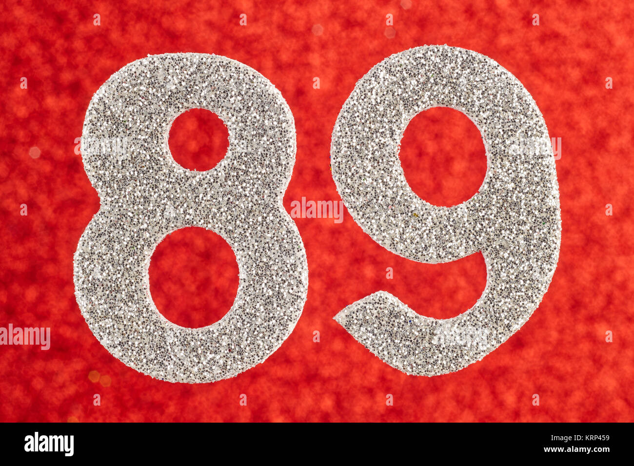 Number eighty-nine silver color over a red background. Anniversary ...