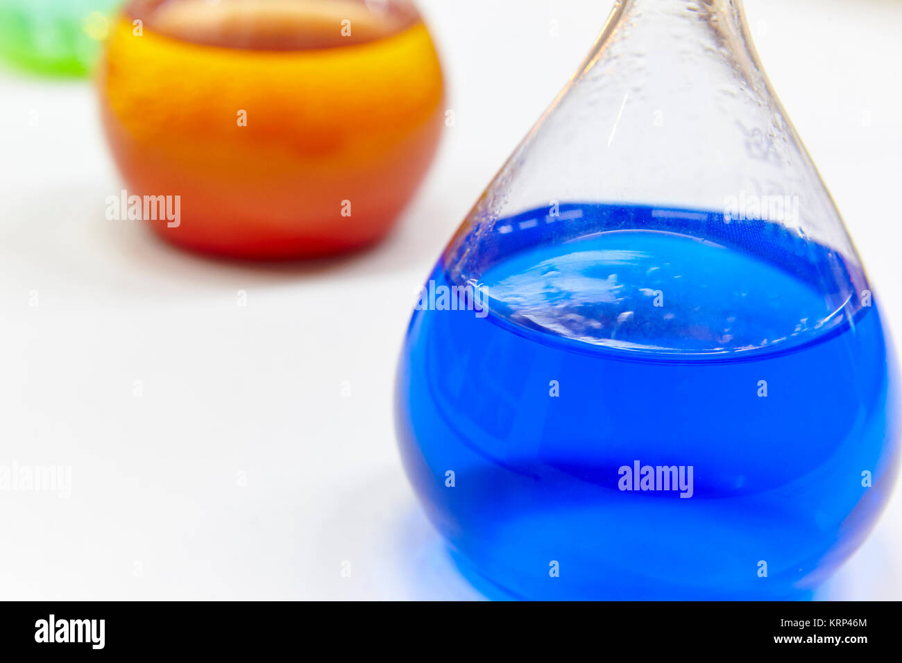 Chemical test flasks with colored lab liquids. Science background ...