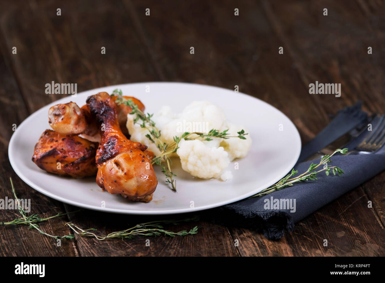 Cauliflower with chicken legs Stock Photo - Alamy