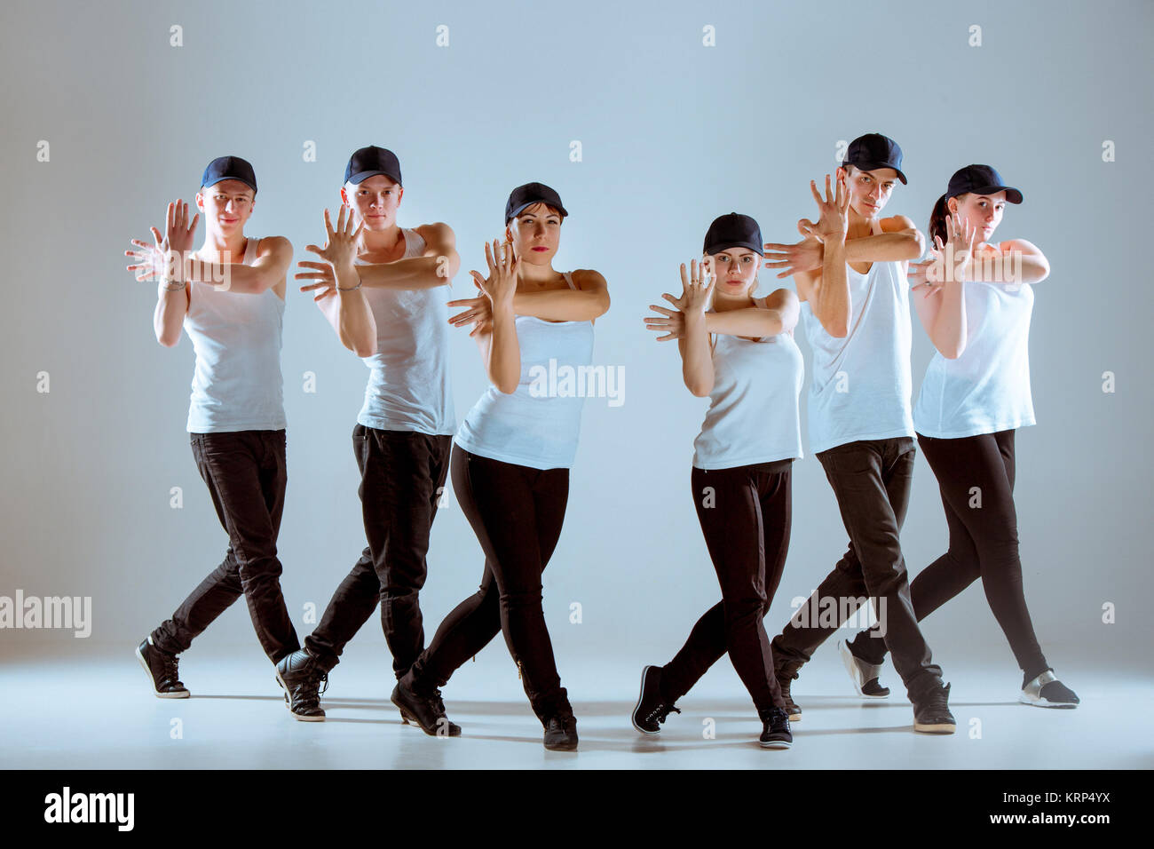 Group of men and women dancing hip hop choreography Stock Photo - Alamy