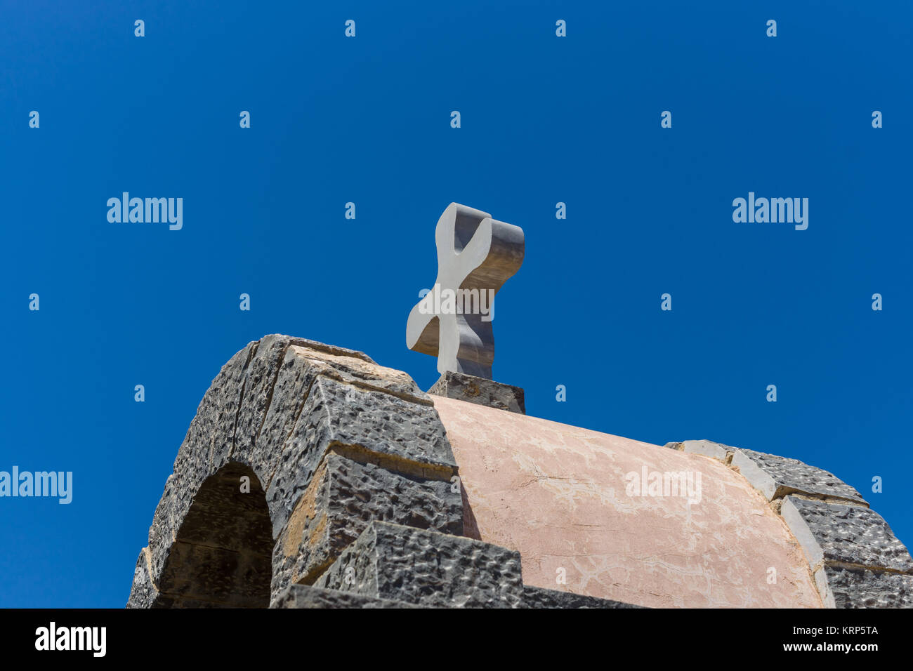 Stone cross against the blue sky Stock Photo - Alamy