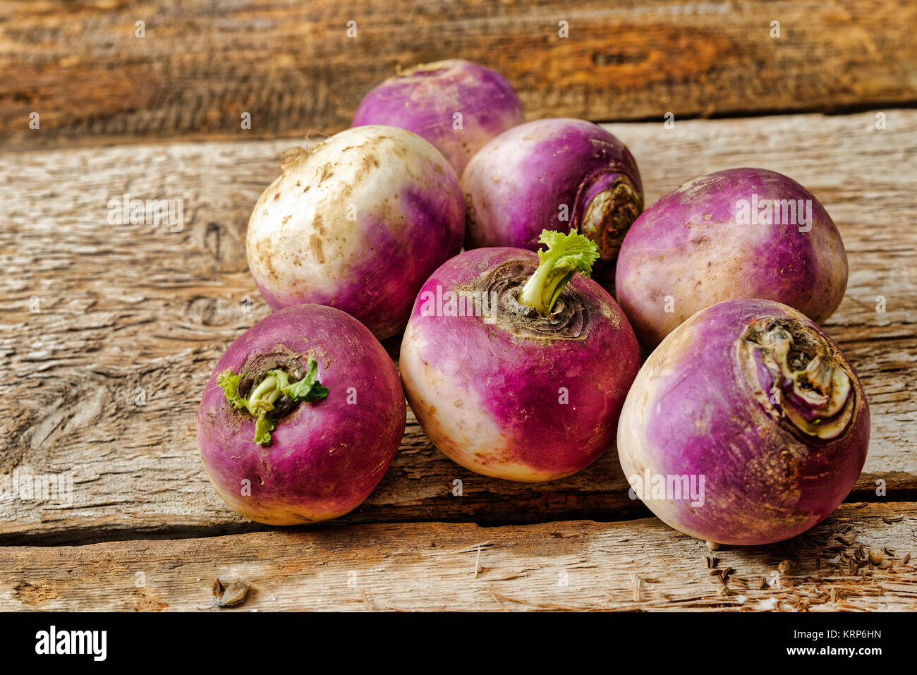 Seven purple turnips on wood Stock Photo - Alamy