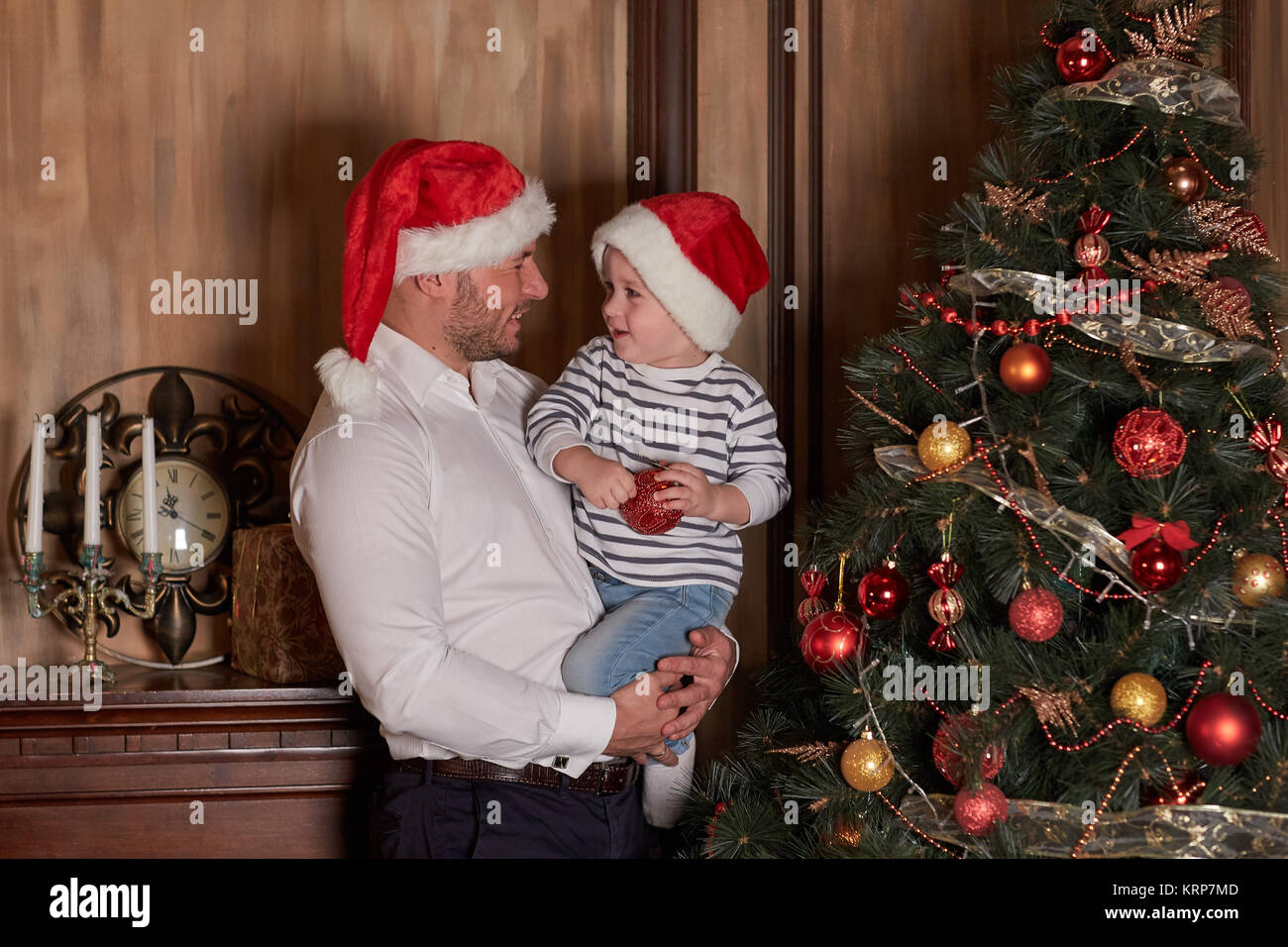 Happy family and Christmas tree Stock Photo - Alamy