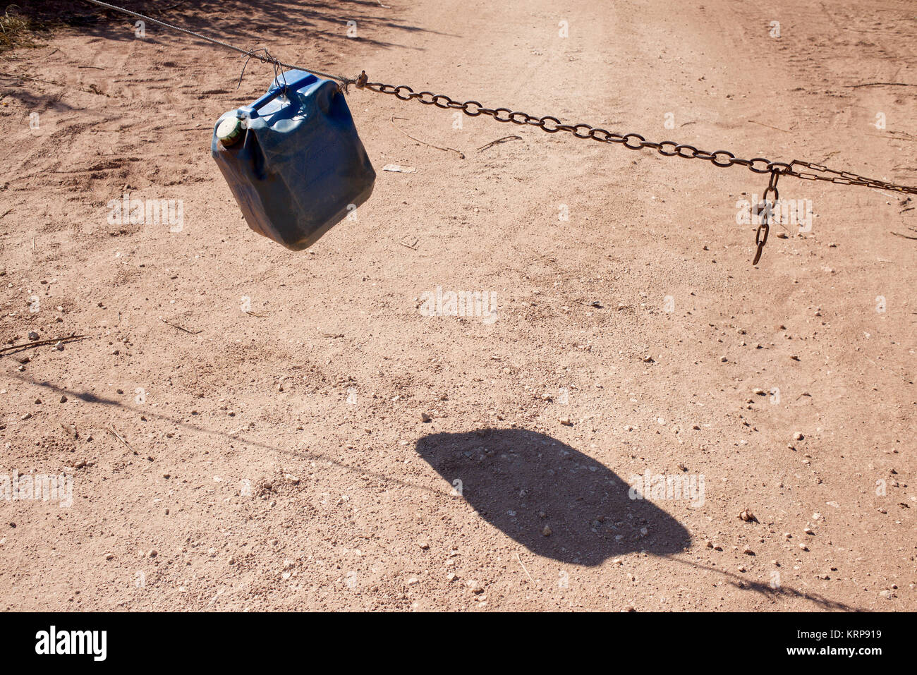 Plastic container on a chain acting as a no entry sign Stock Photo - Alamy