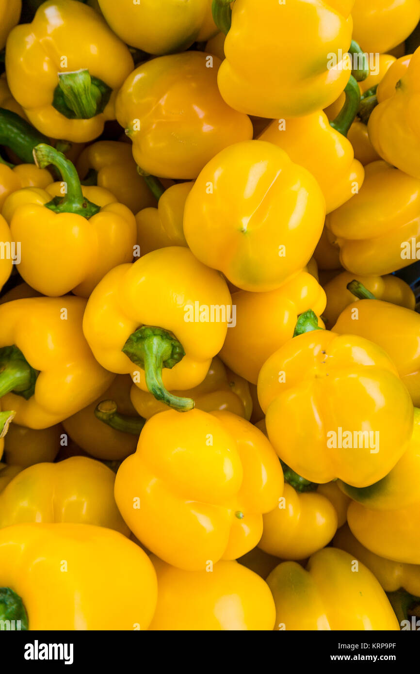 Background of Yellow Pepper. Heap Of Ripe Big Yellow Peppers Stock ...