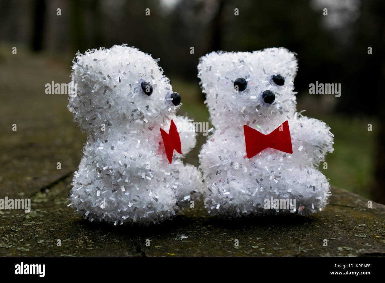 two toy white bears on a bench in park Stock Photo - Alamy