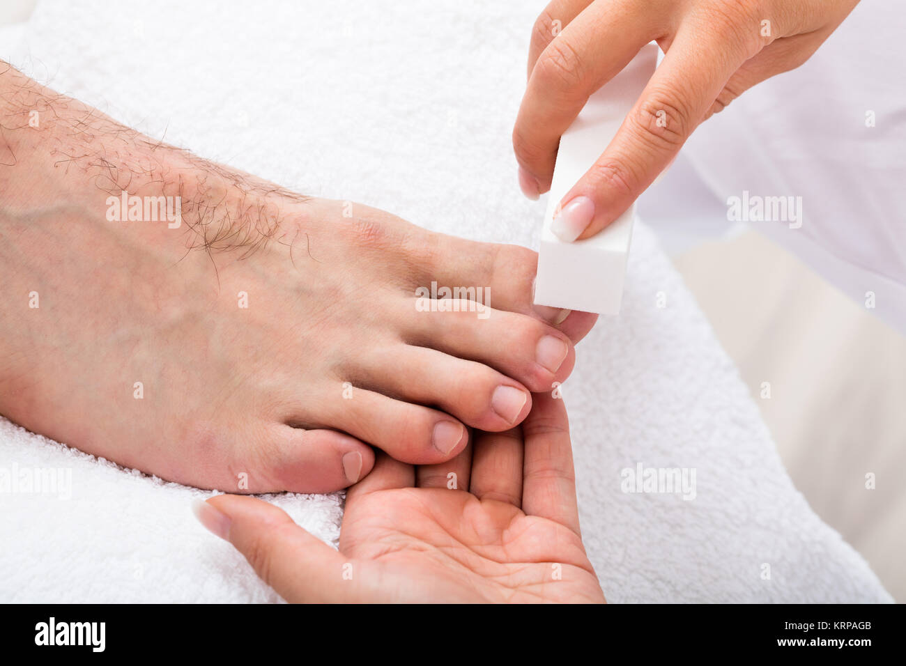 Beautician Hand Filing The Nails Stock Photo - Alamy