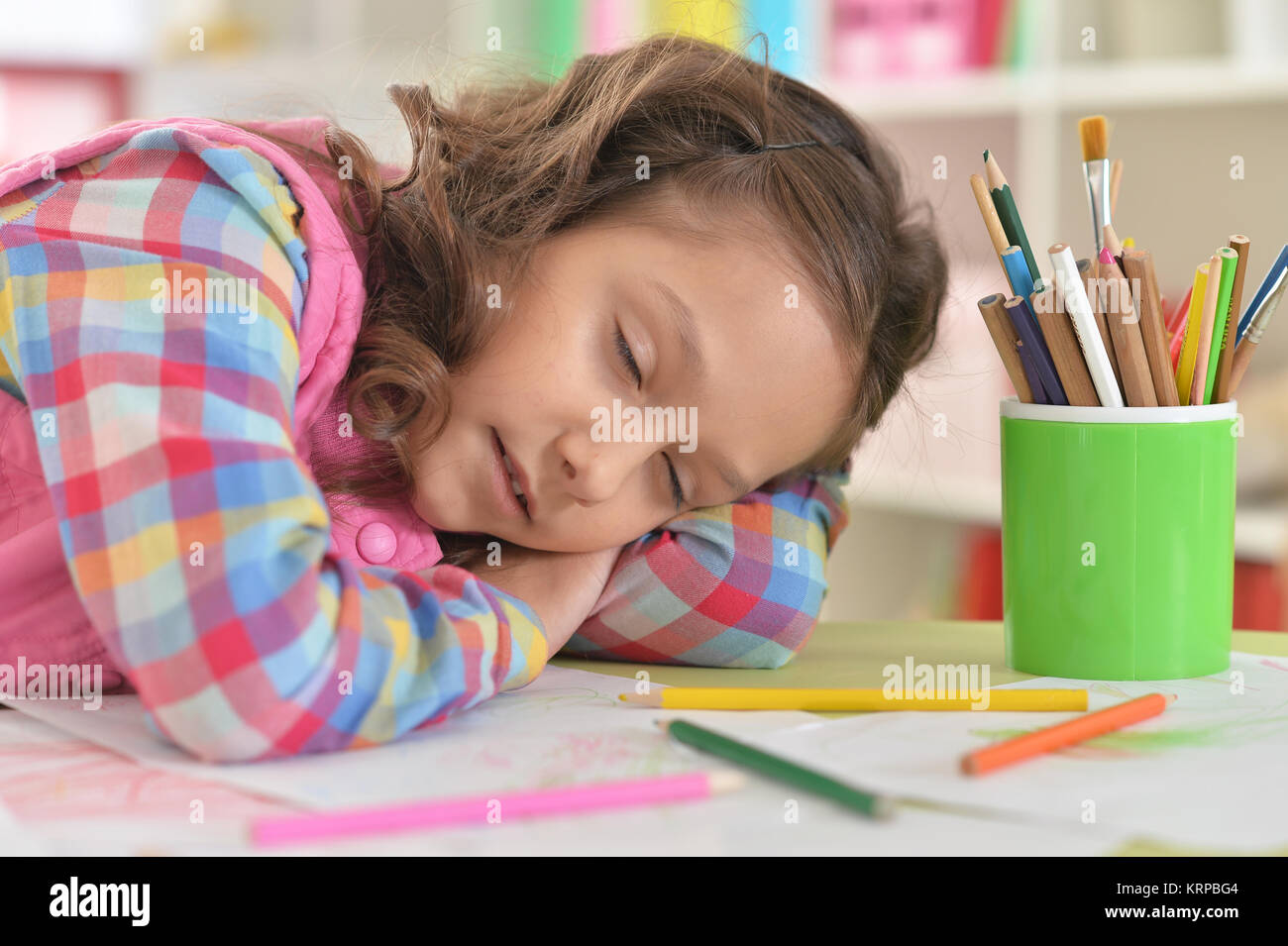 girl sleeping at table Stock Photo - Alamy