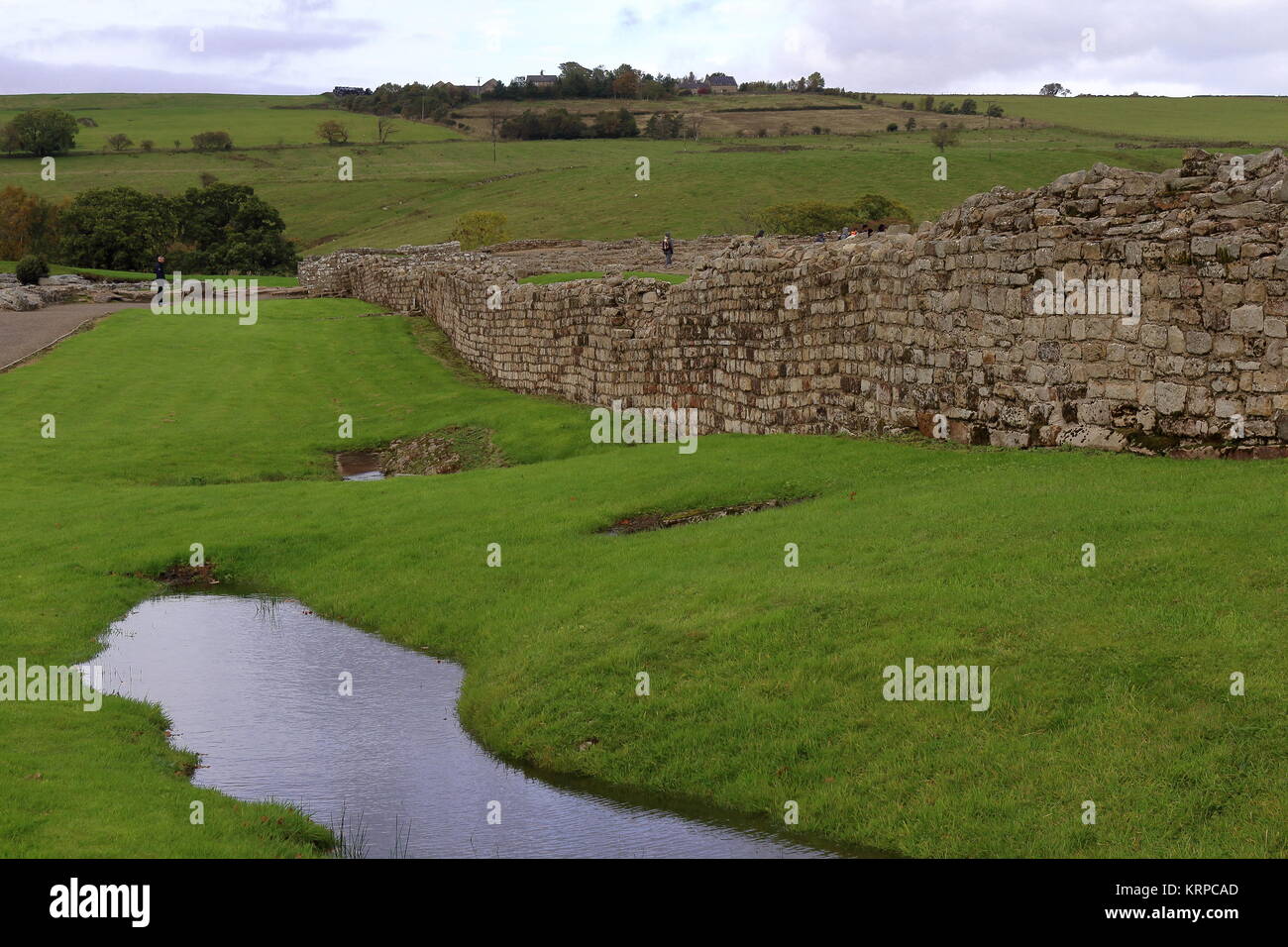 Outer stone wall of Vindolanda Roman fort, with rainwater in outer ...