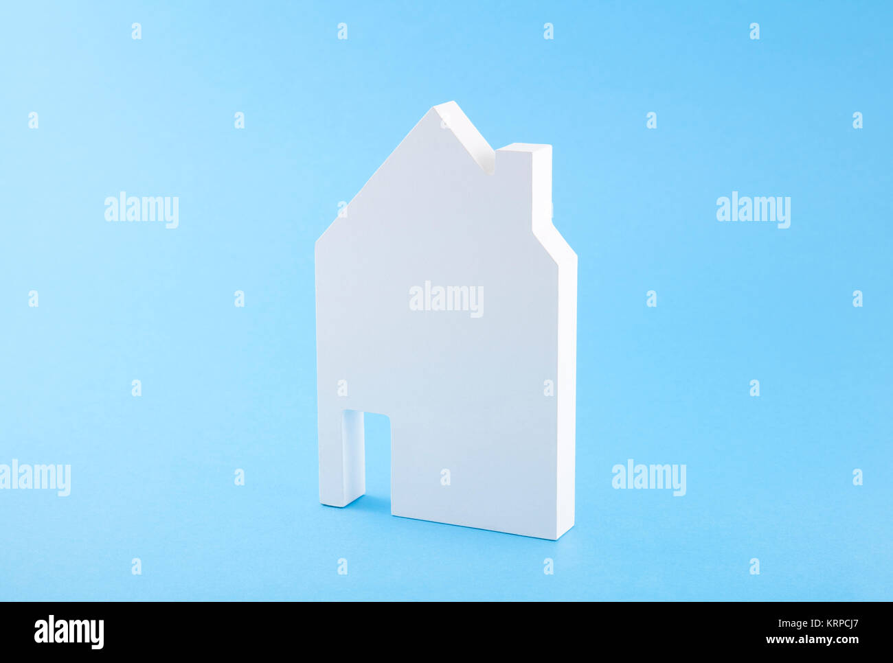 House shape on blue background Stock Photo - Alamy