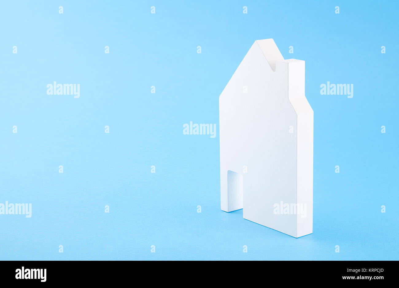 House shape on blue background Stock Photo - Alamy