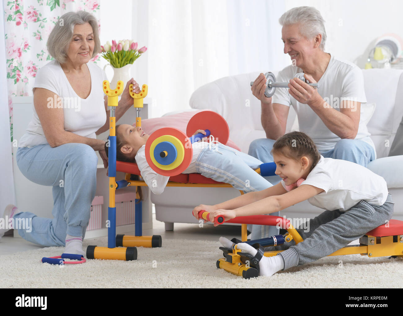 grandparents and little granddaughters doing exercises Stock Photo - Alamy