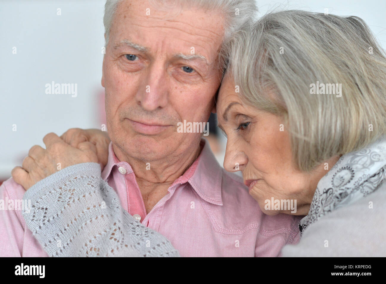sad senior couple posing Stock Photo - Alamy
