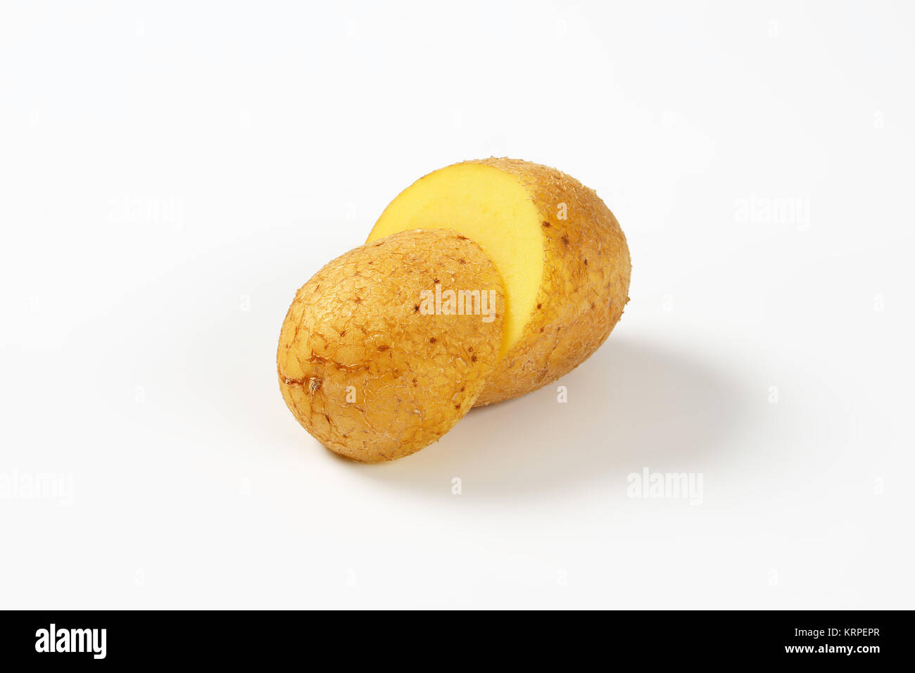 halved raw potato Stock Photo - Alamy