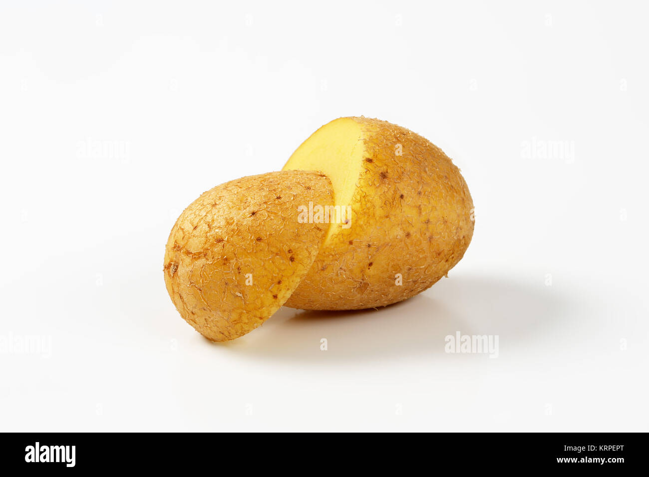 halved raw potato Stock Photo - Alamy