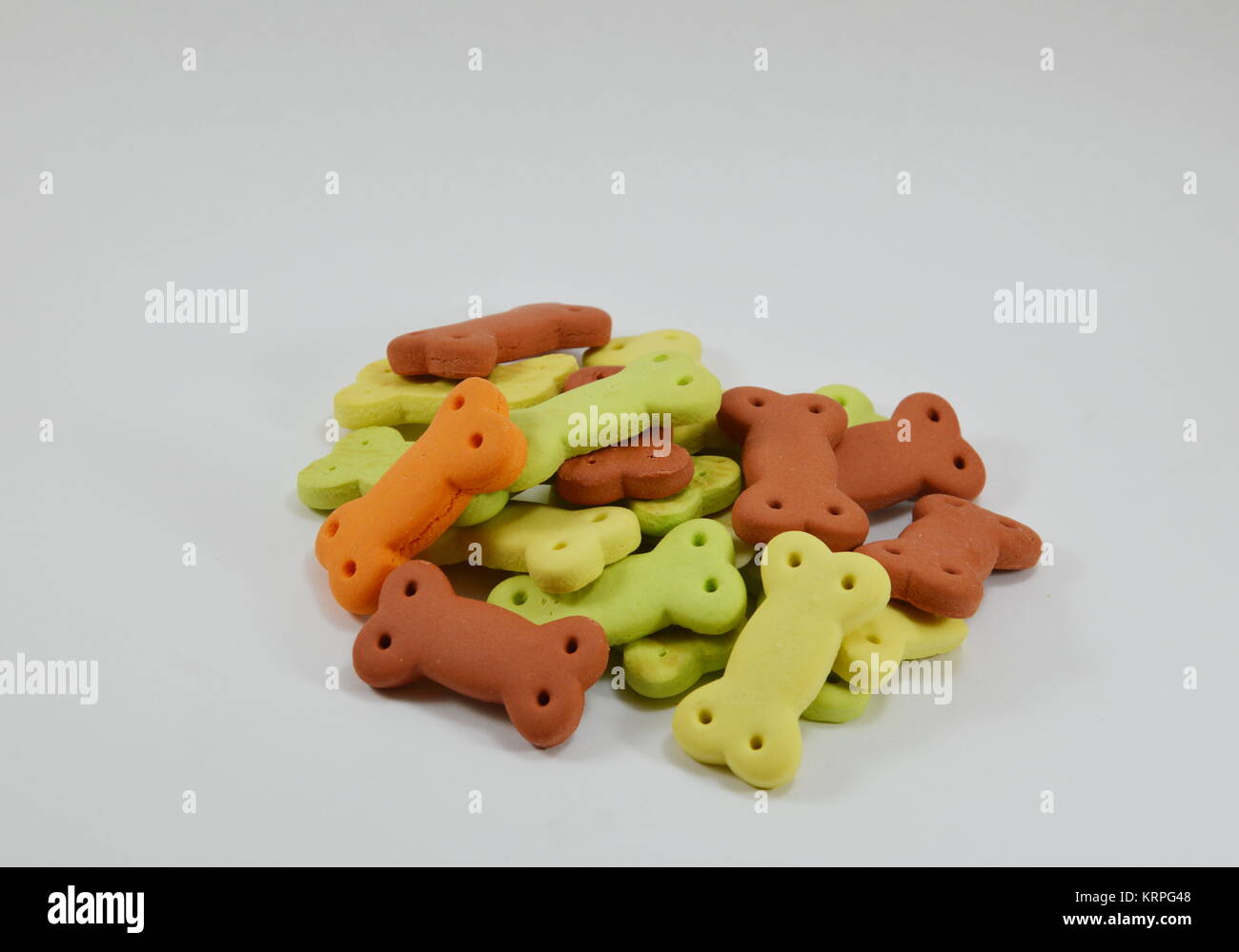 dog snack biscuit in many color on white background Stock Photo - Alamy