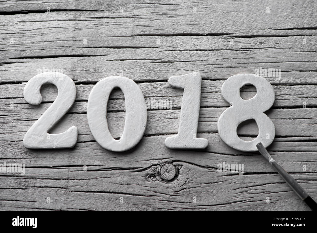 high angle shot of four white numbers forming the number 2018, as the ...