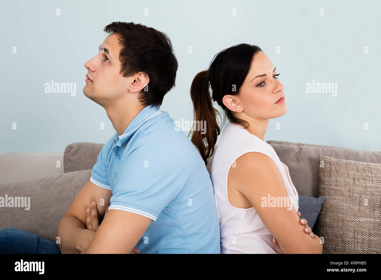 Close Up Of Sad Couple Sitting Back To Back Stock Photo - Alamy