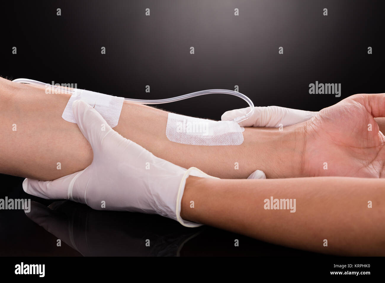 Doctor Holding Patient's Hand With Iv Drip Stock Photo - Alamy