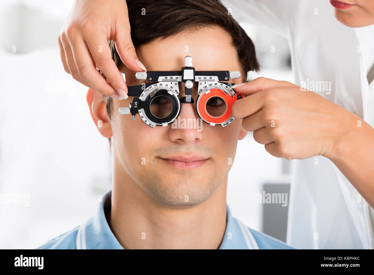 An Optometrist Checking Patient Vision With Trial Frame Stock Photo - Alamy