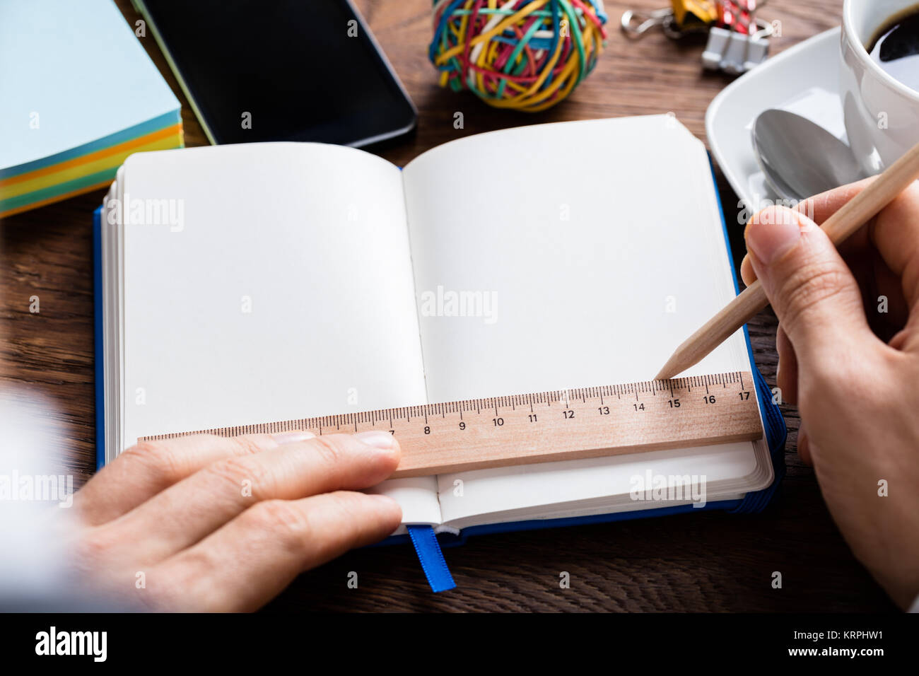Person Hand Drawing Line With Scale On Notebook Stock Photo - Alamy