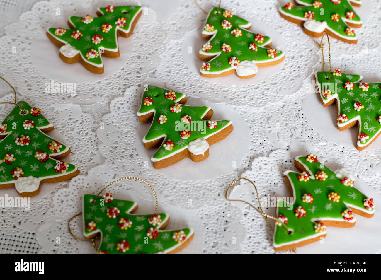 Painted gingerbread in the shape of Christmas tree on a white napkin ...
