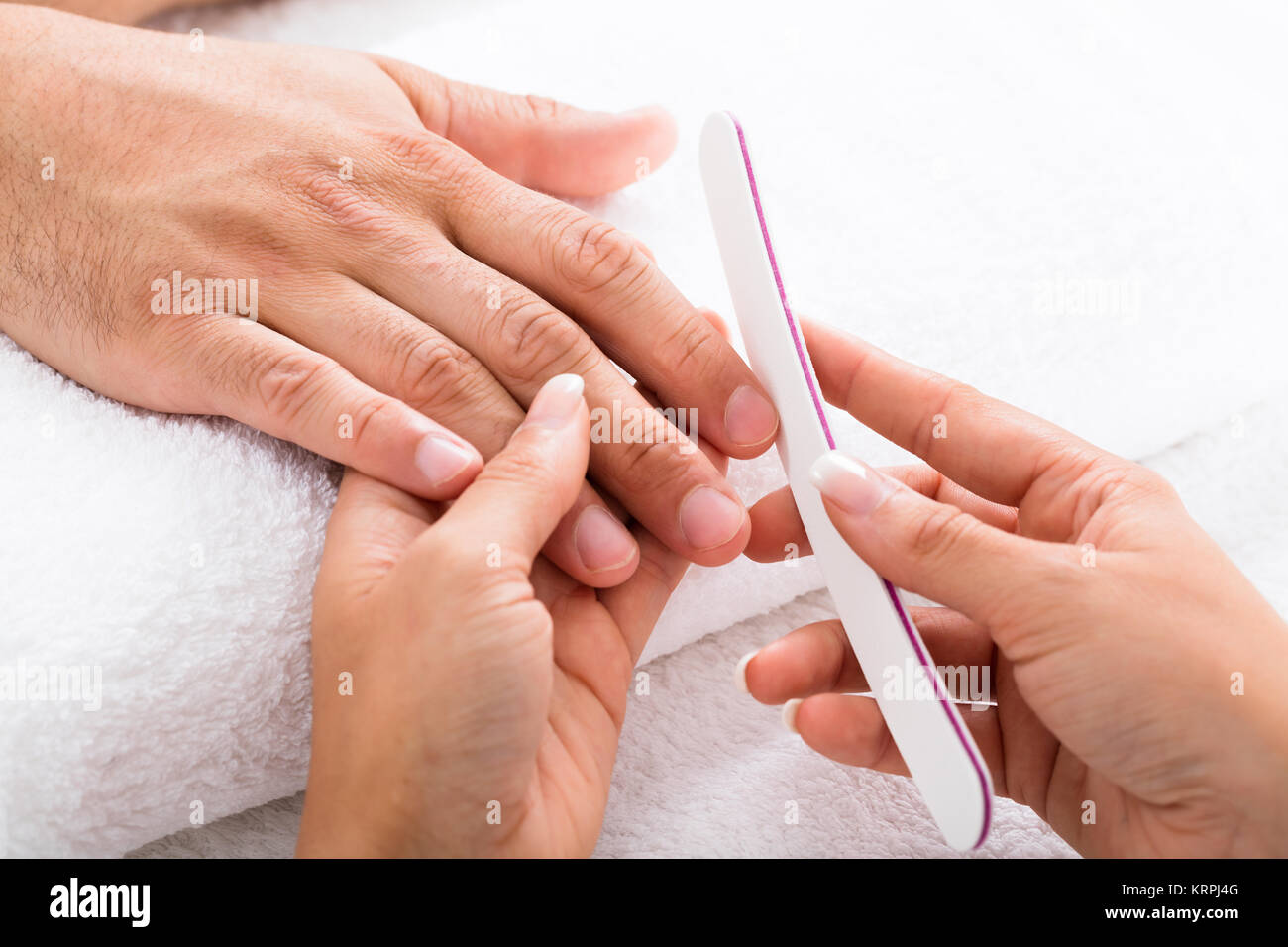 Manicurist Filing Person's Nails Stock Photo - Alamy