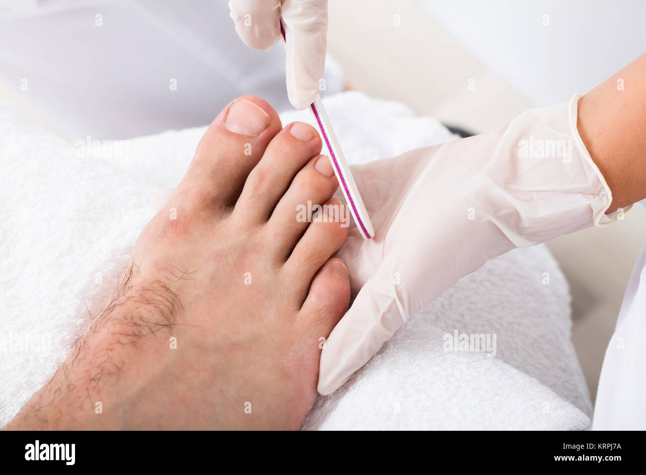 Beautician Hand Filling Person's Nail Stock Photo - Alamy