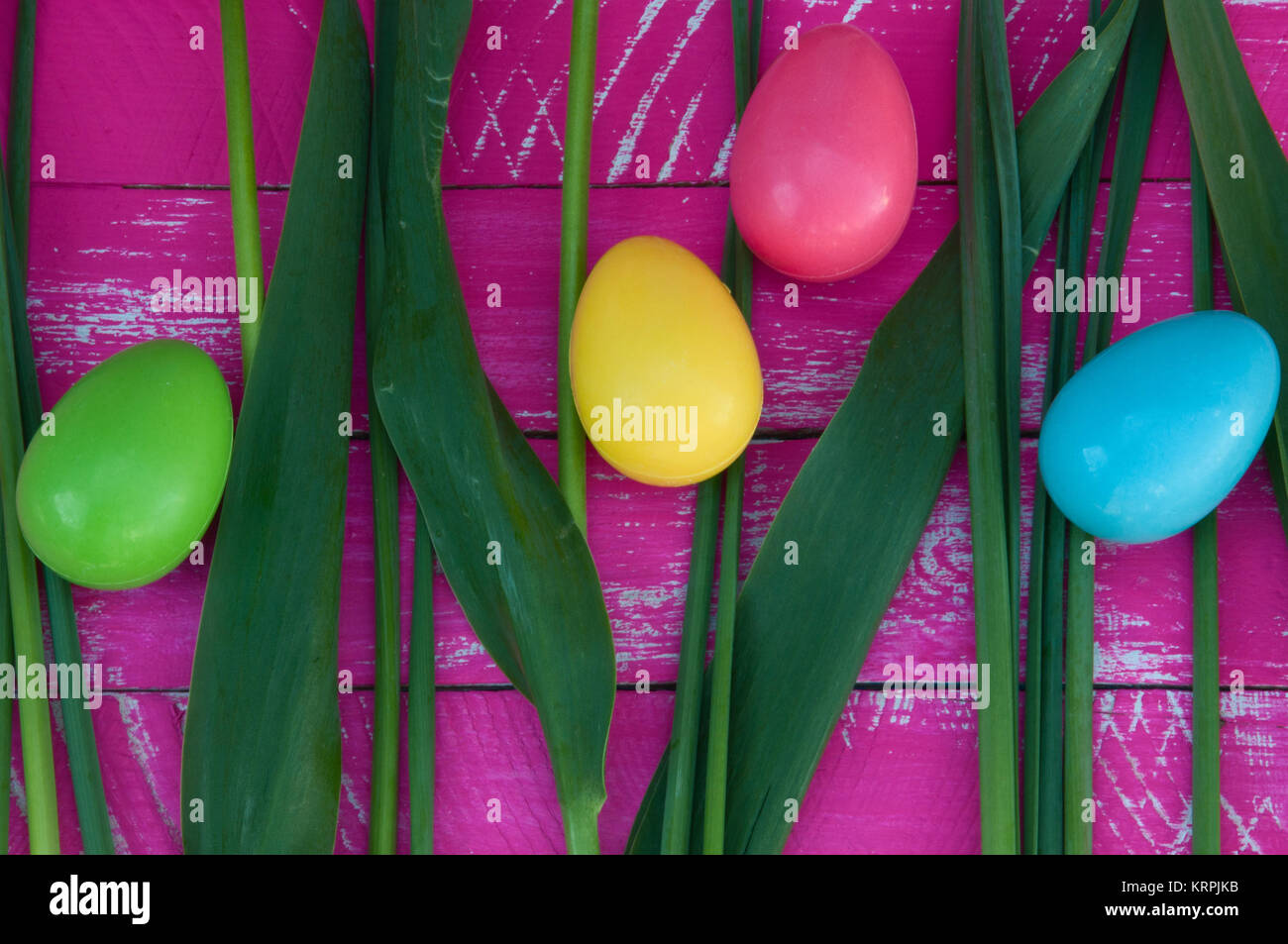 Easter pink background with colorful chocolate eggs Stock Photo - Alamy