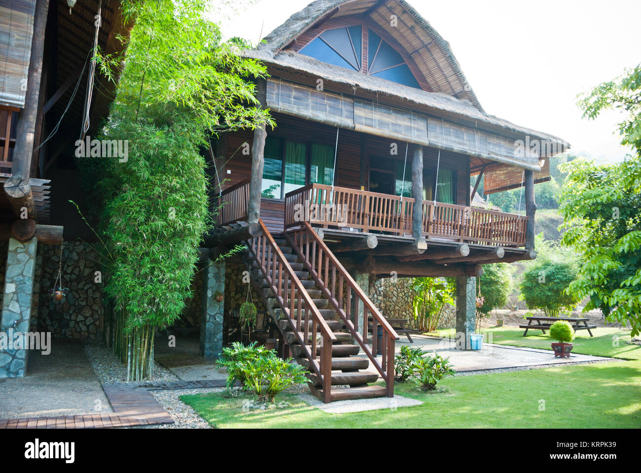 wooden timber housse - Cozy timber house amongst green environment ...