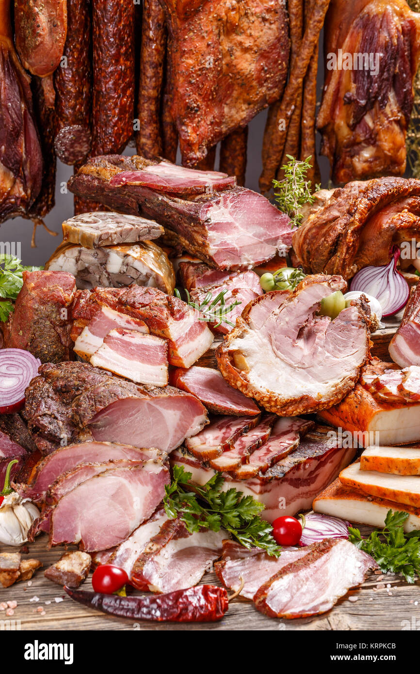 Still life of various smoked pork meat Stock Photo - Alamy