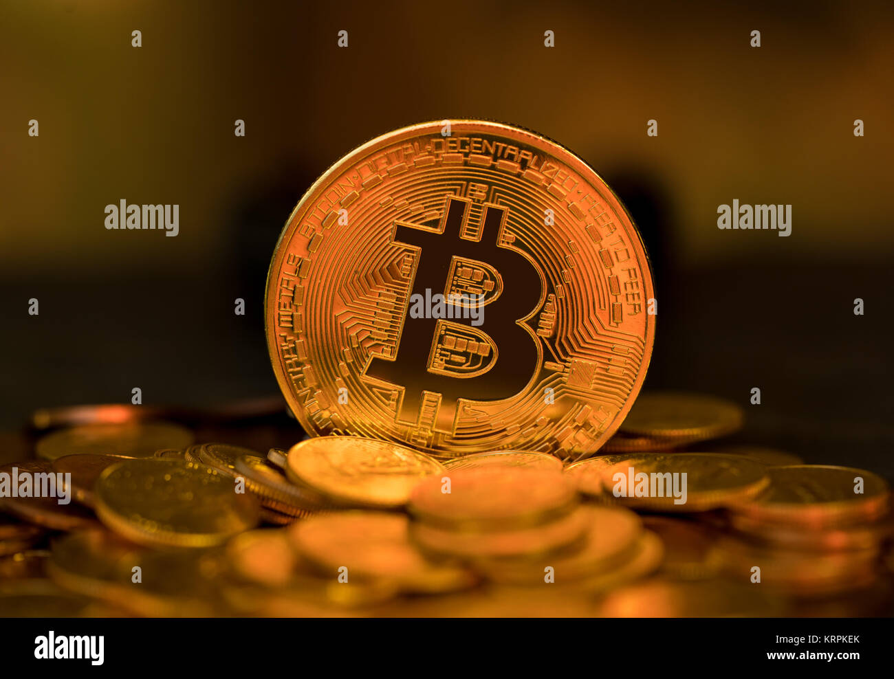 Stack of bitcoins with gold background Stock Photo - Alamy