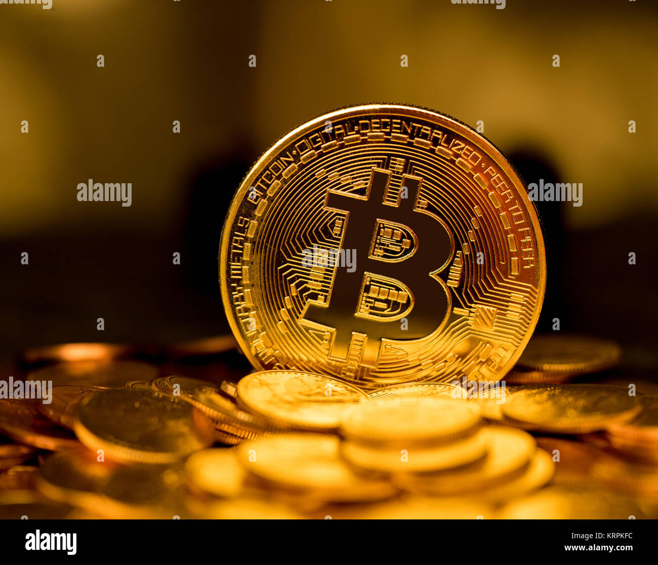 Stack of bitcoins with gold background Stock Photo - Alamy