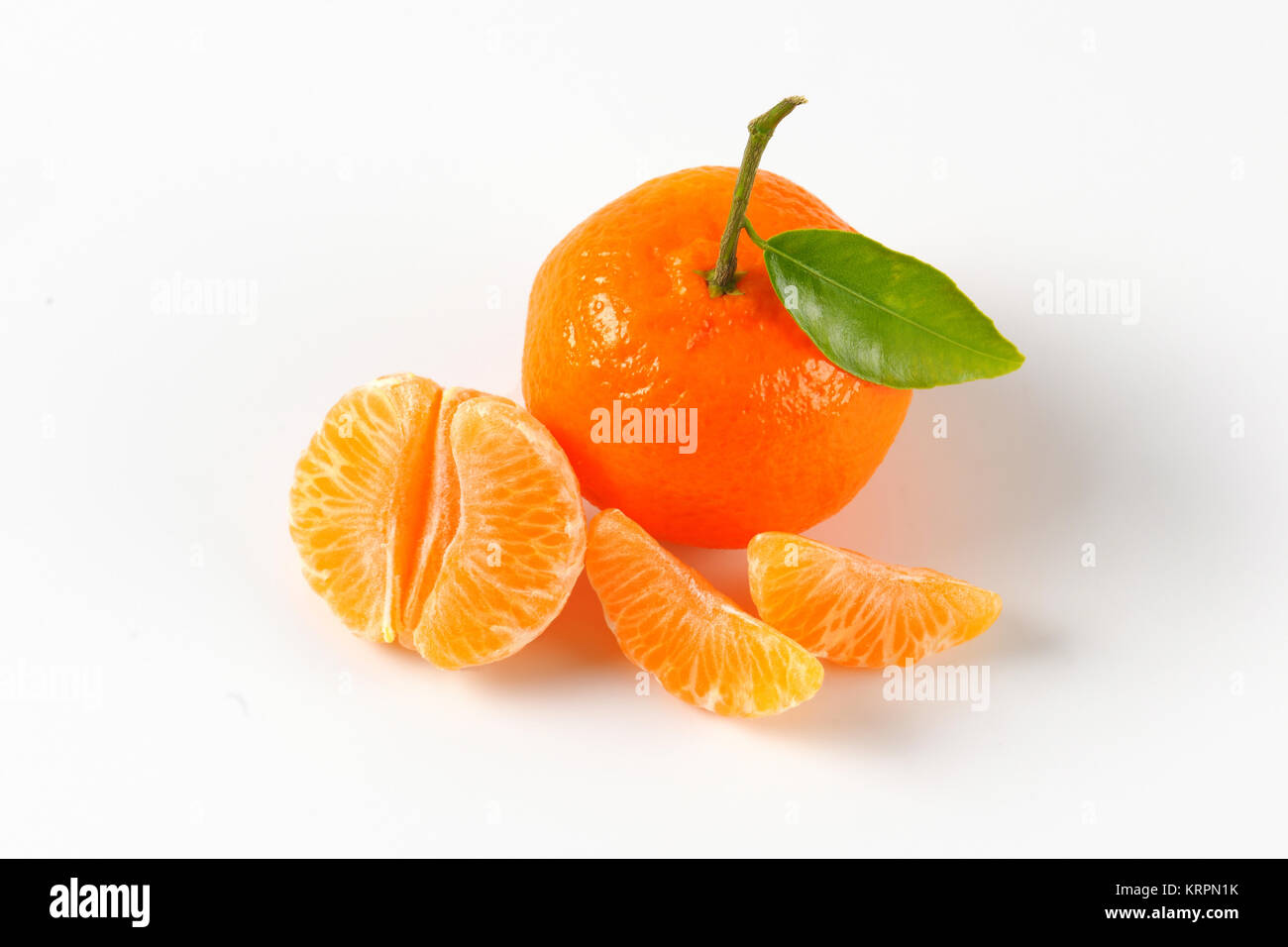 tangerine with separated segments Stock Photo - Alamy