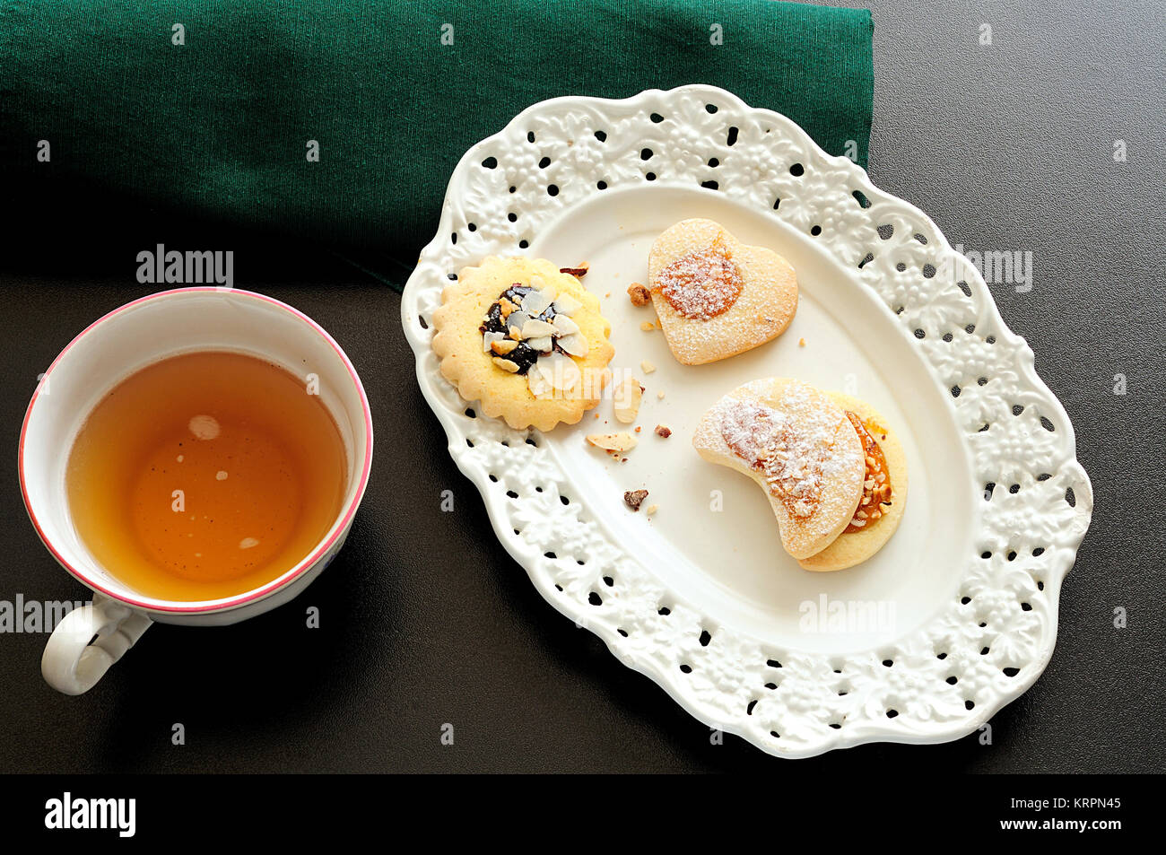 Old tray with pastries for tea and a cup of tea, top view Stock Photo ...