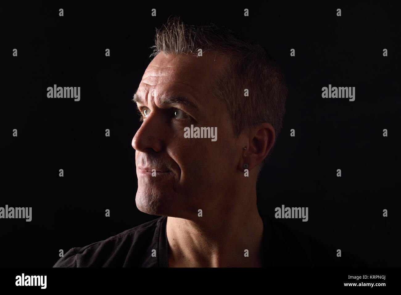 portrait of a man on black background Stock Photo - Alamy
