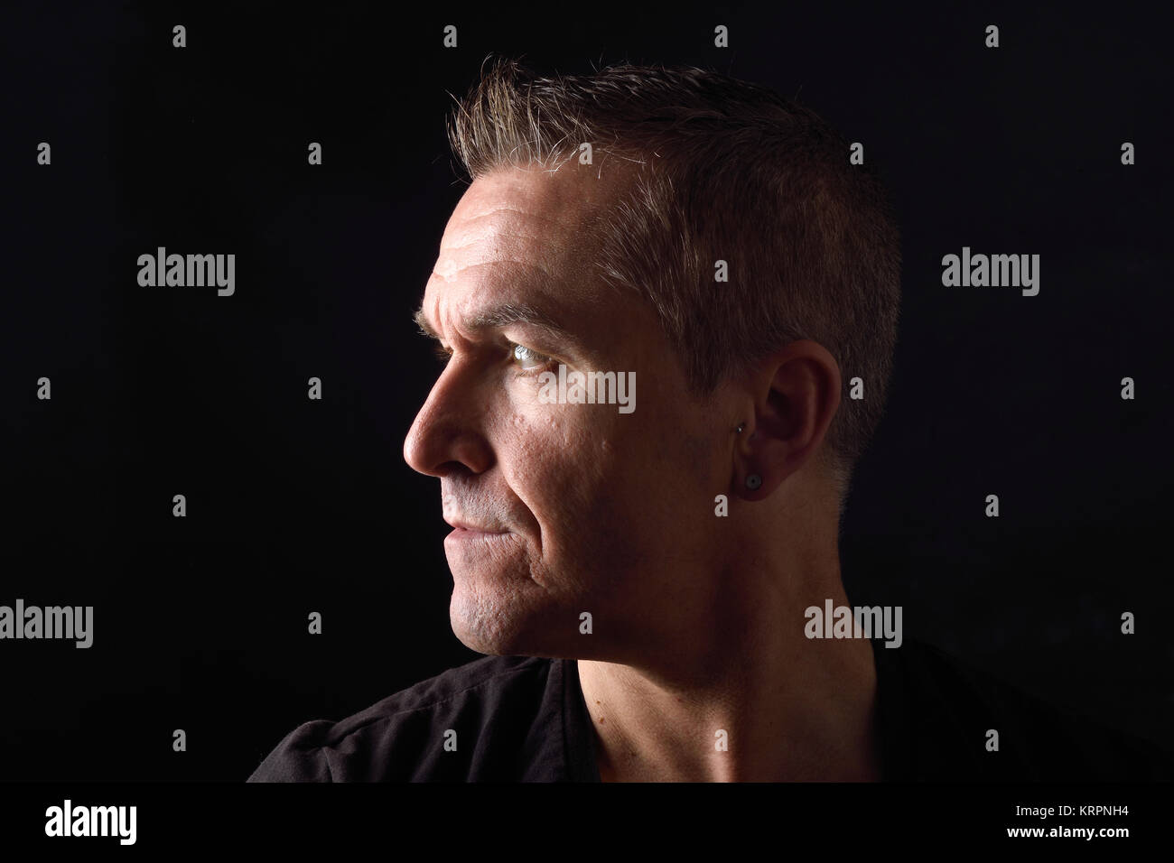 portrait of a man on black background Stock Photo - Alamy