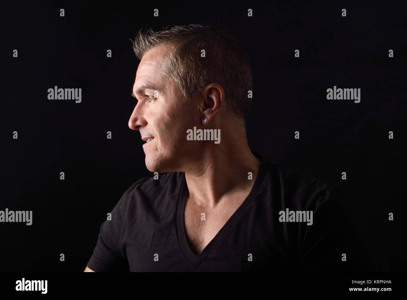 portrait of a man on black background Stock Photo - Alamy