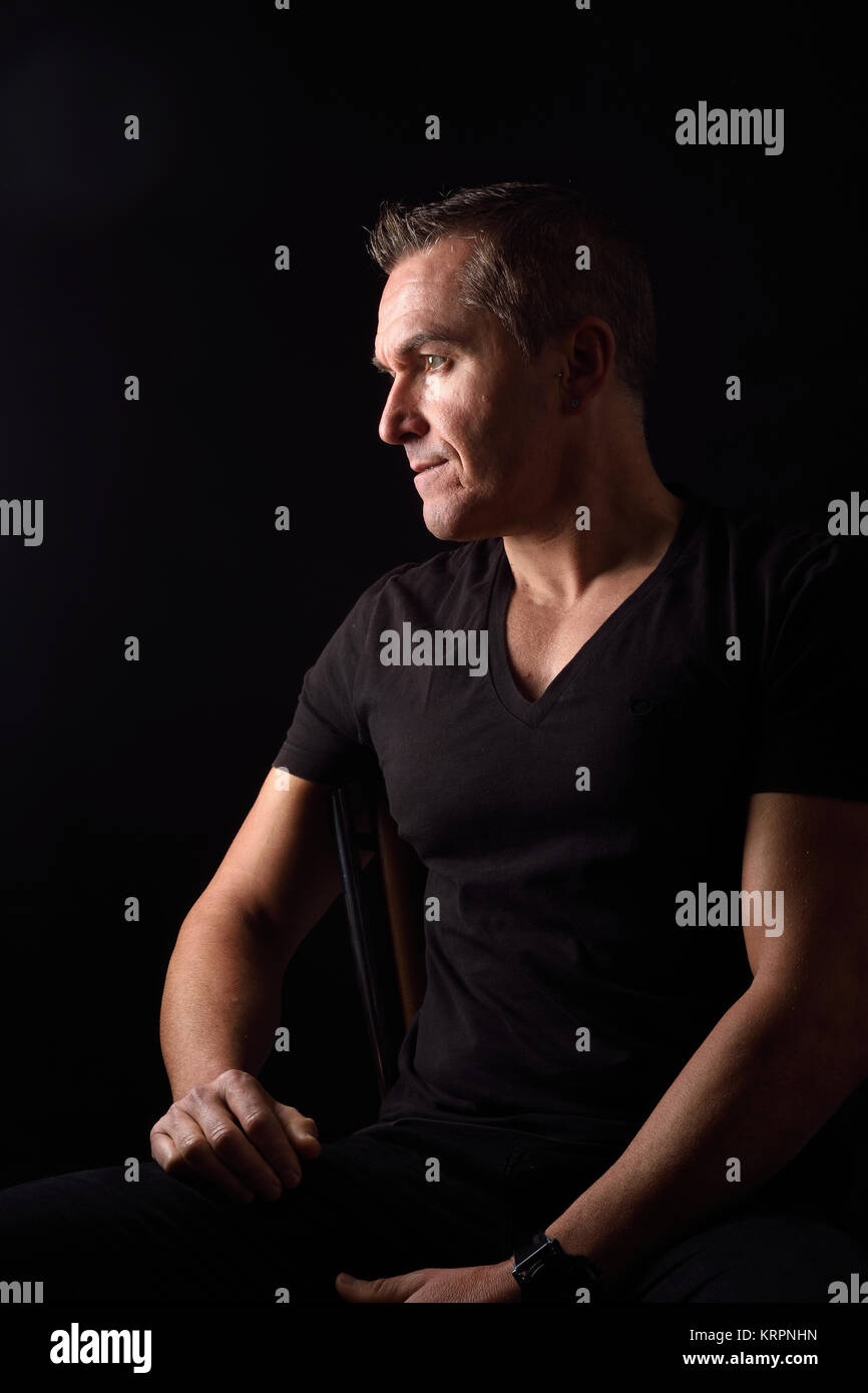 portrait of a man on black background Stock Photo - Alamy