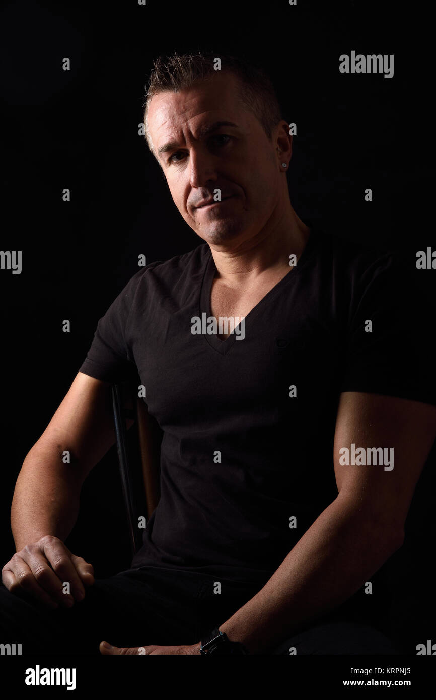 portrait of a man on black background Stock Photo - Alamy
