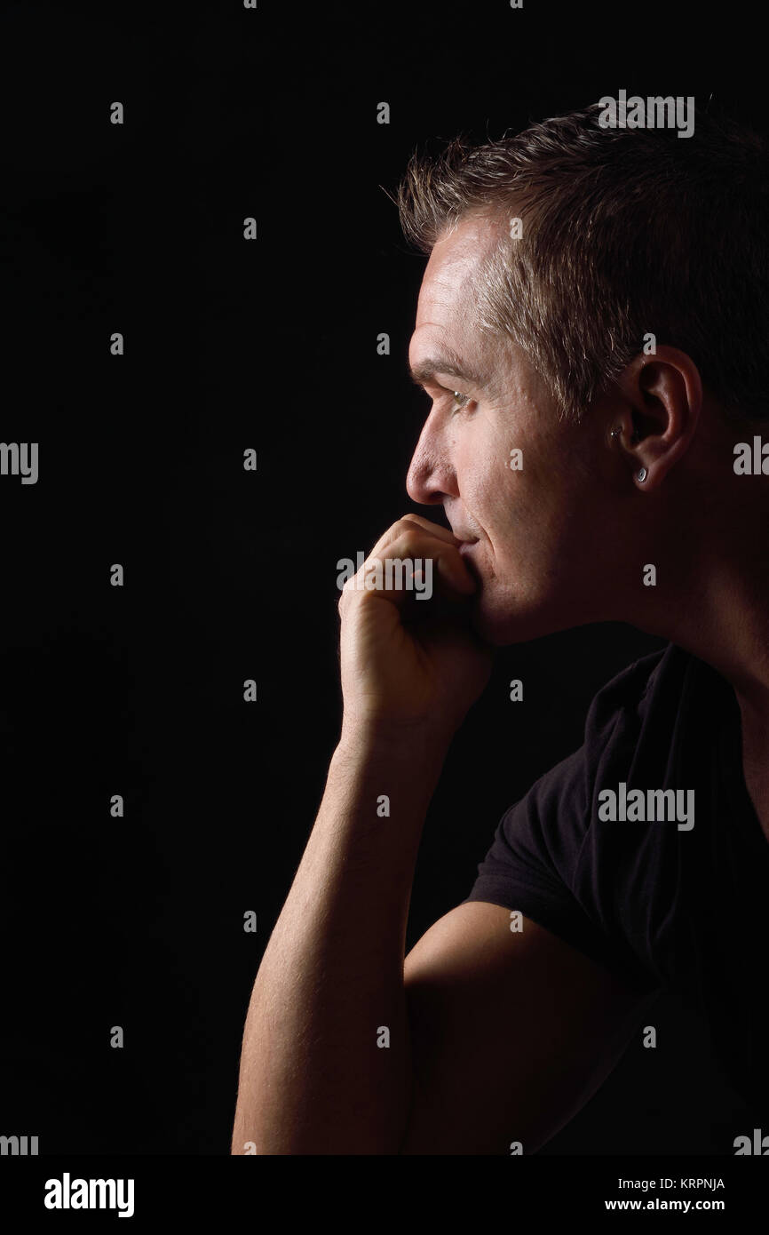 portrait of a man on black background Stock Photo - Alamy