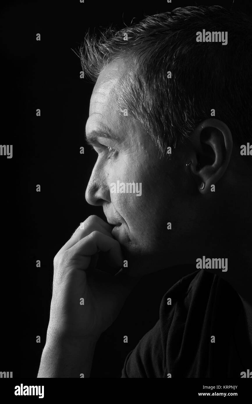 portrait of a man on black background Stock Photo - Alamy