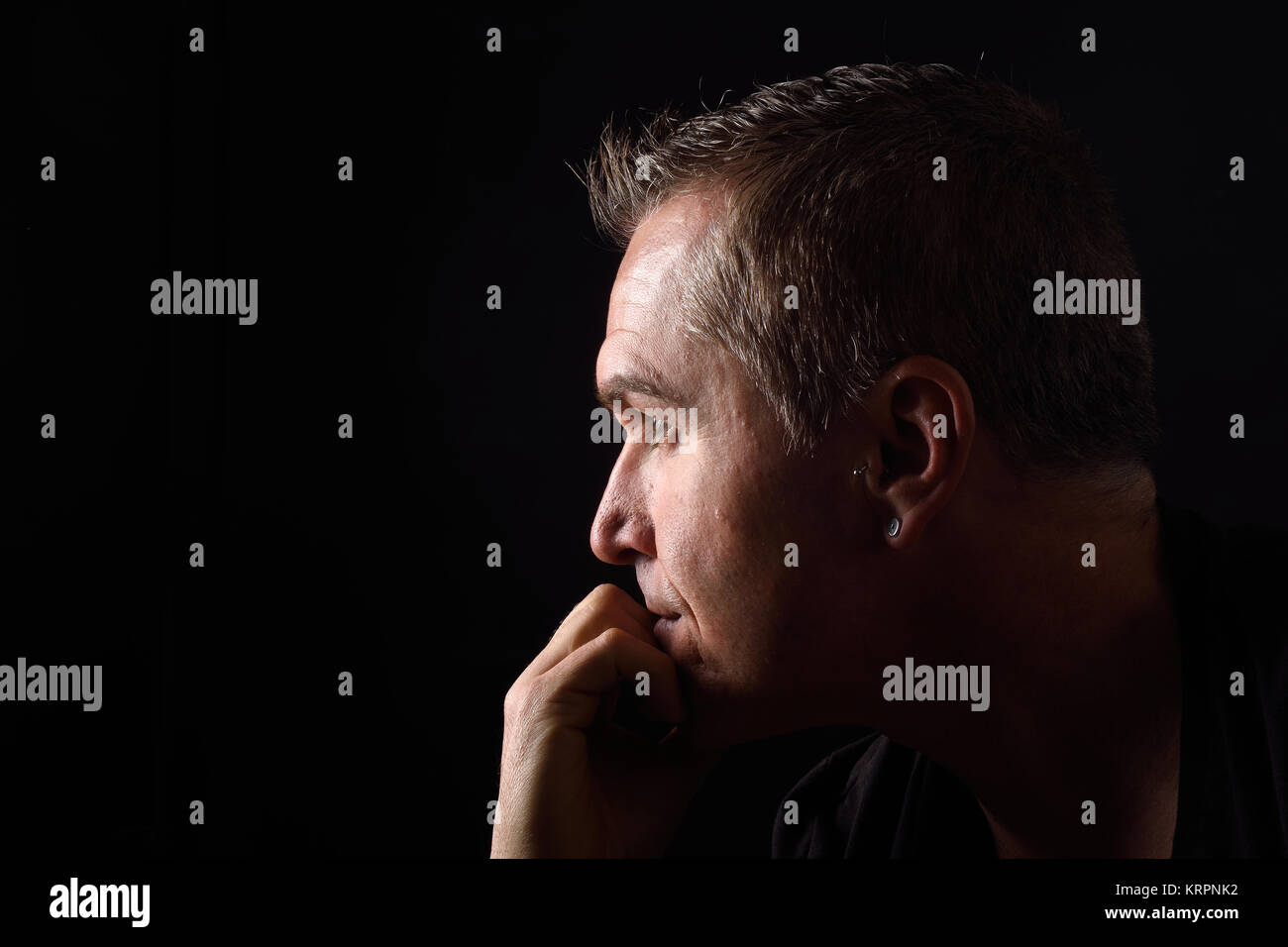 portrait of a man on black background Stock Photo - Alamy