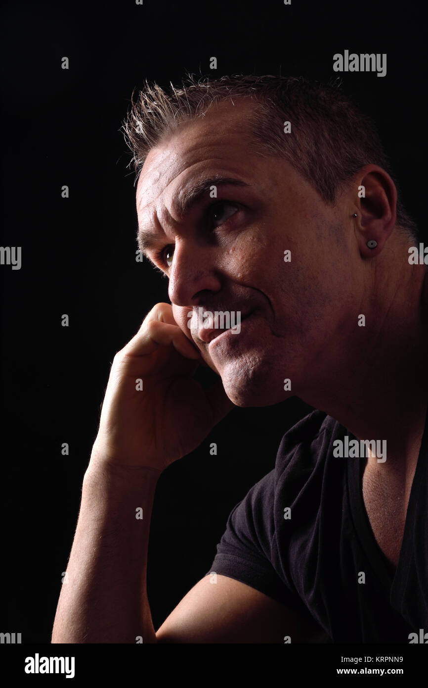 portrait of a man on black background Stock Photo - Alamy