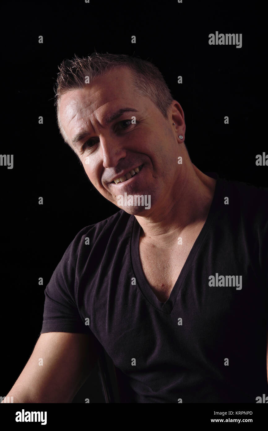 portrait of a man on black background Stock Photo - Alamy