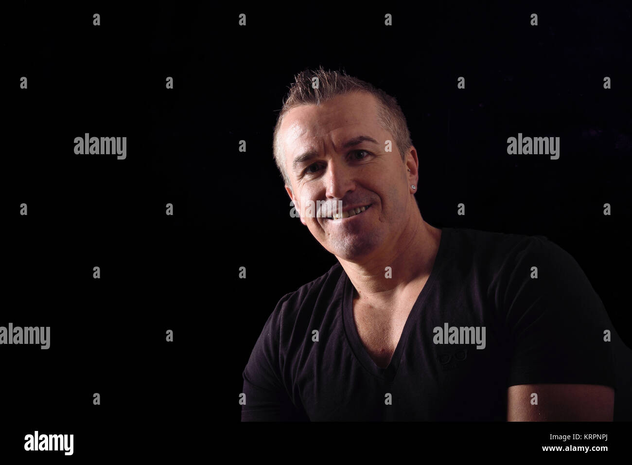 portrait of a man on black background Stock Photo - Alamy